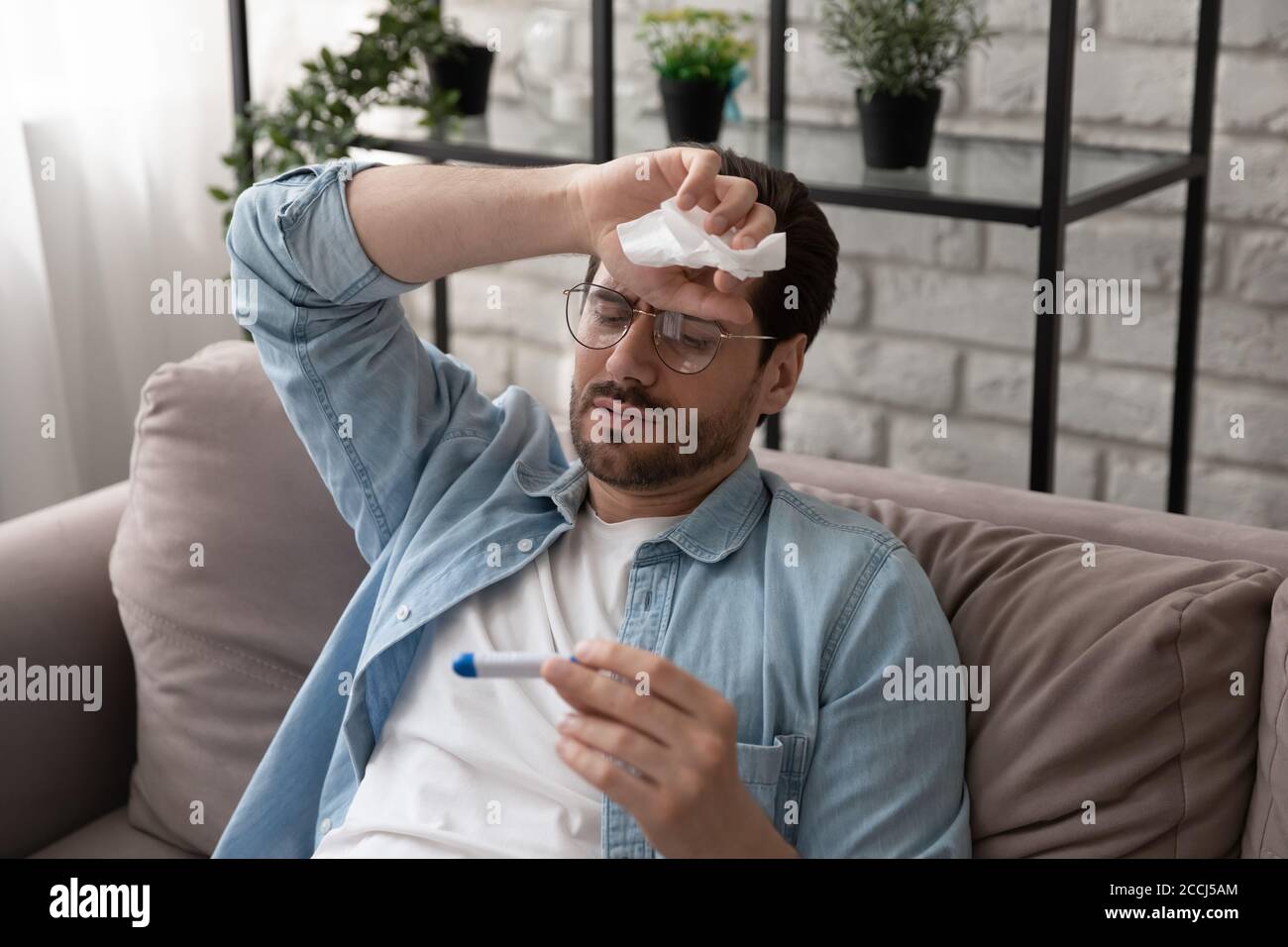 Sick man suffer from fever have flu symptoms at home Stock Photo - Alamy
