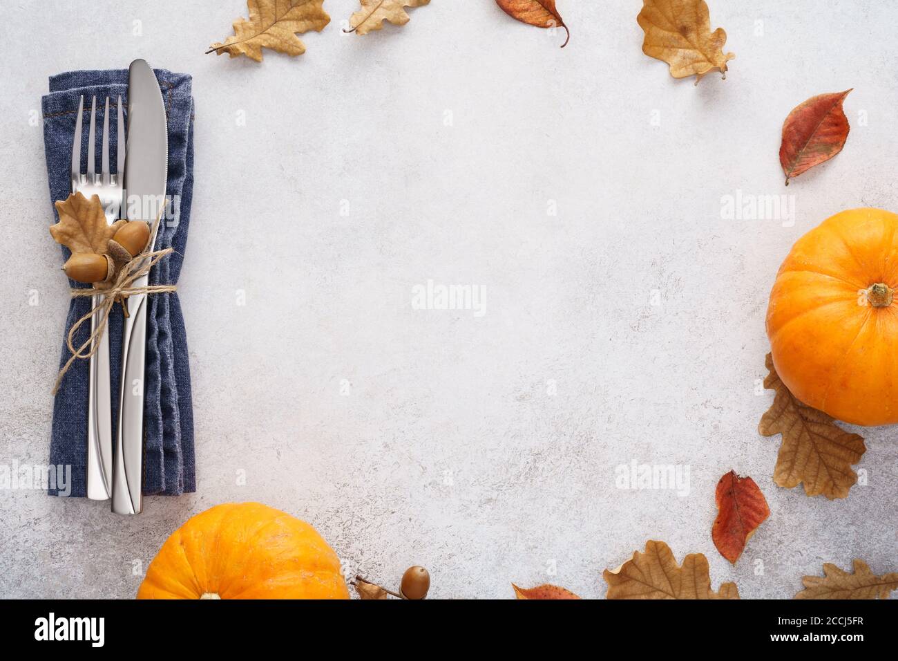 Fall season background with decorated cutlery, leaves and pumpkins ...