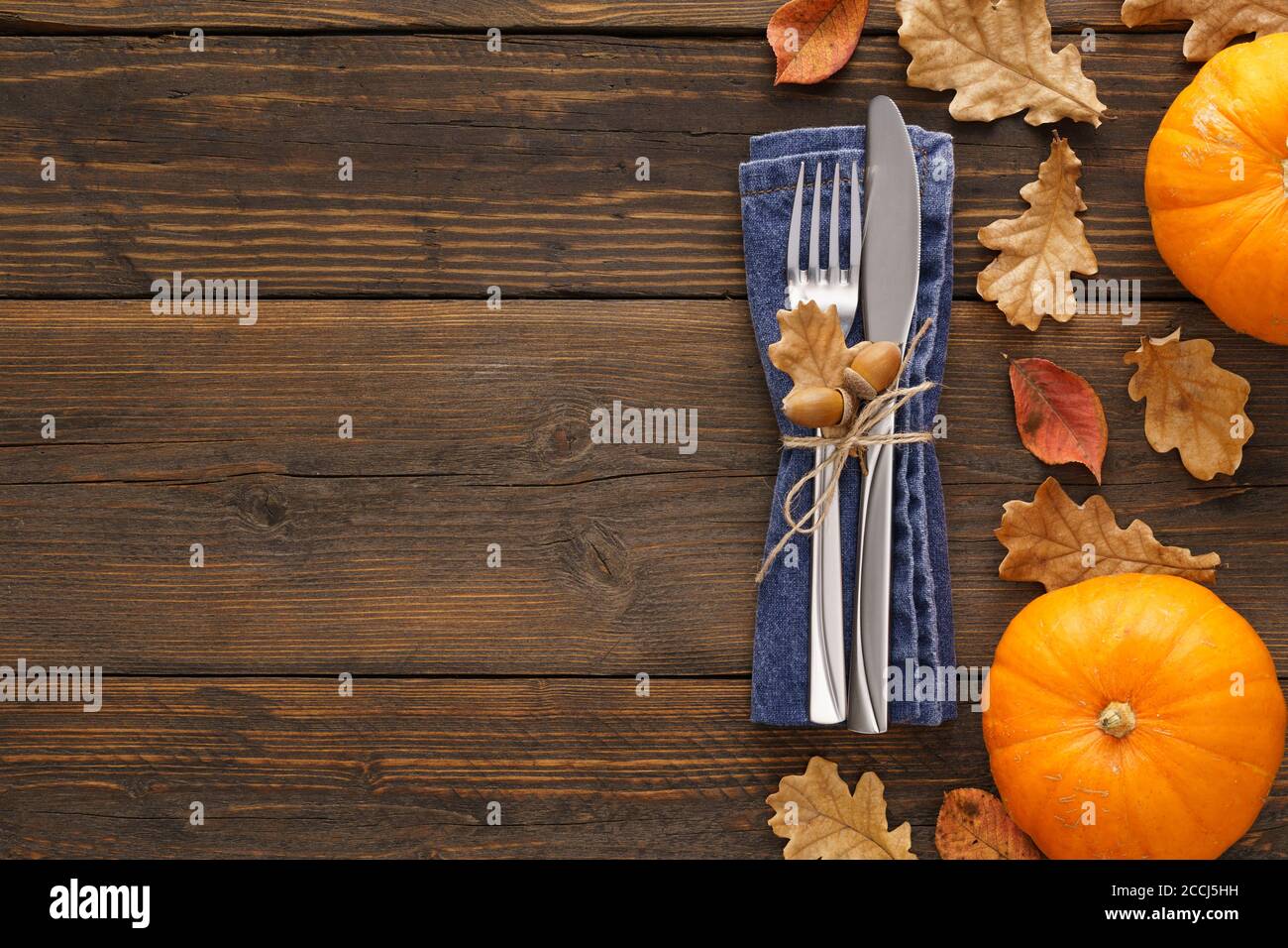 Fall season background with decorated cutlery, leaves and pumpkins ...
