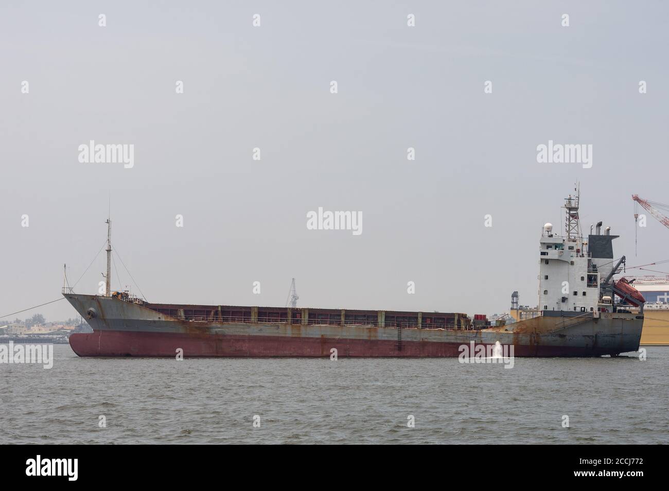 KAOHSIUNG, TAIWAN - CIRCA June, 2018:A large cargo ship moves towards ...
