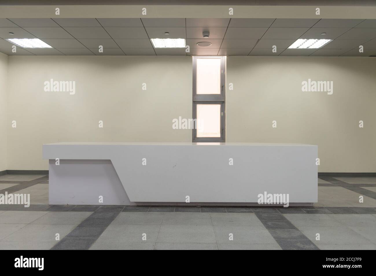 Reception desk in a corridor with large panoramic window with wide ...