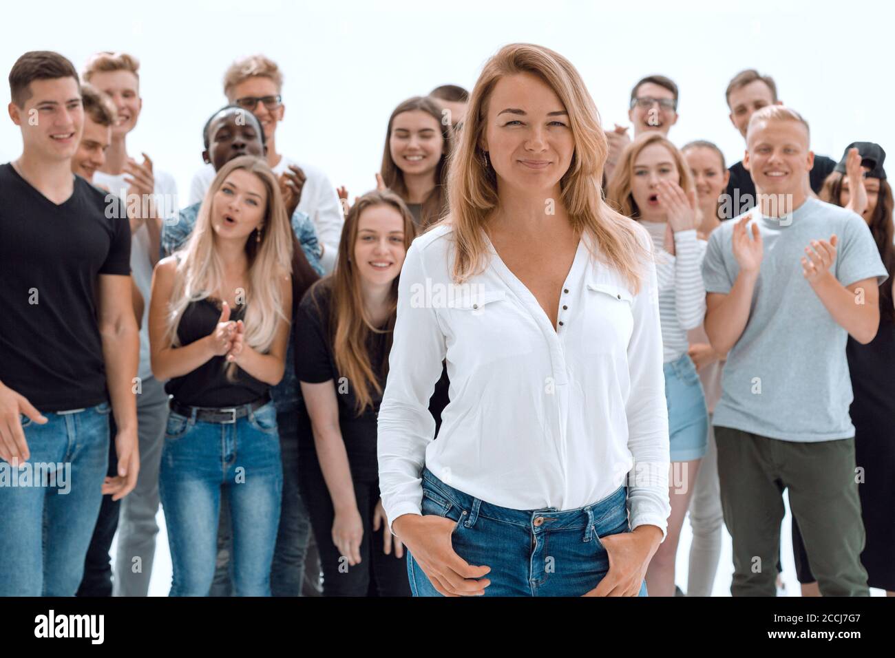 confident young woman leader standing in front of her associates Stock ...