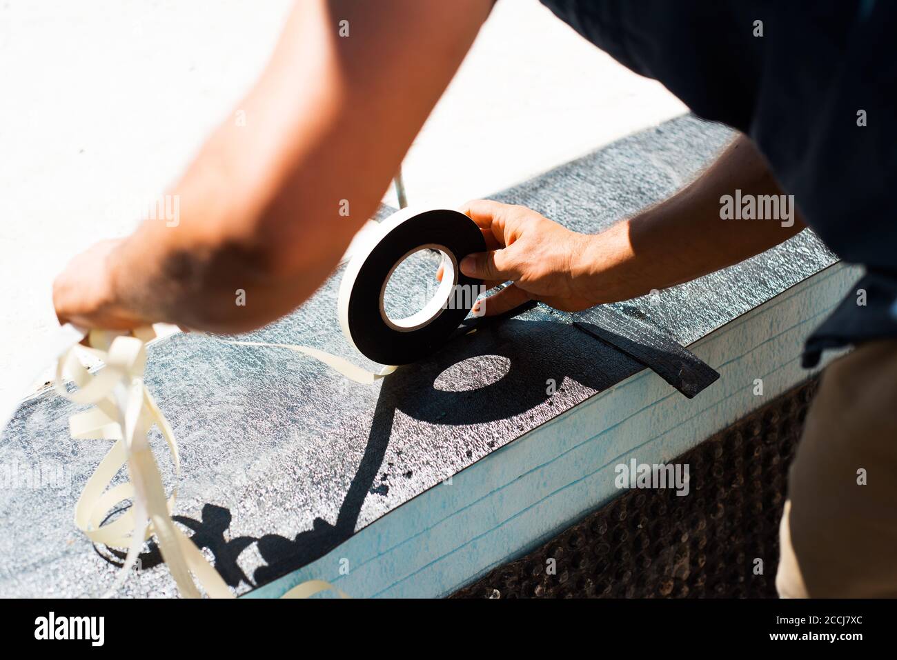 close up photo of worker man making isolation with tape, preparing for ...