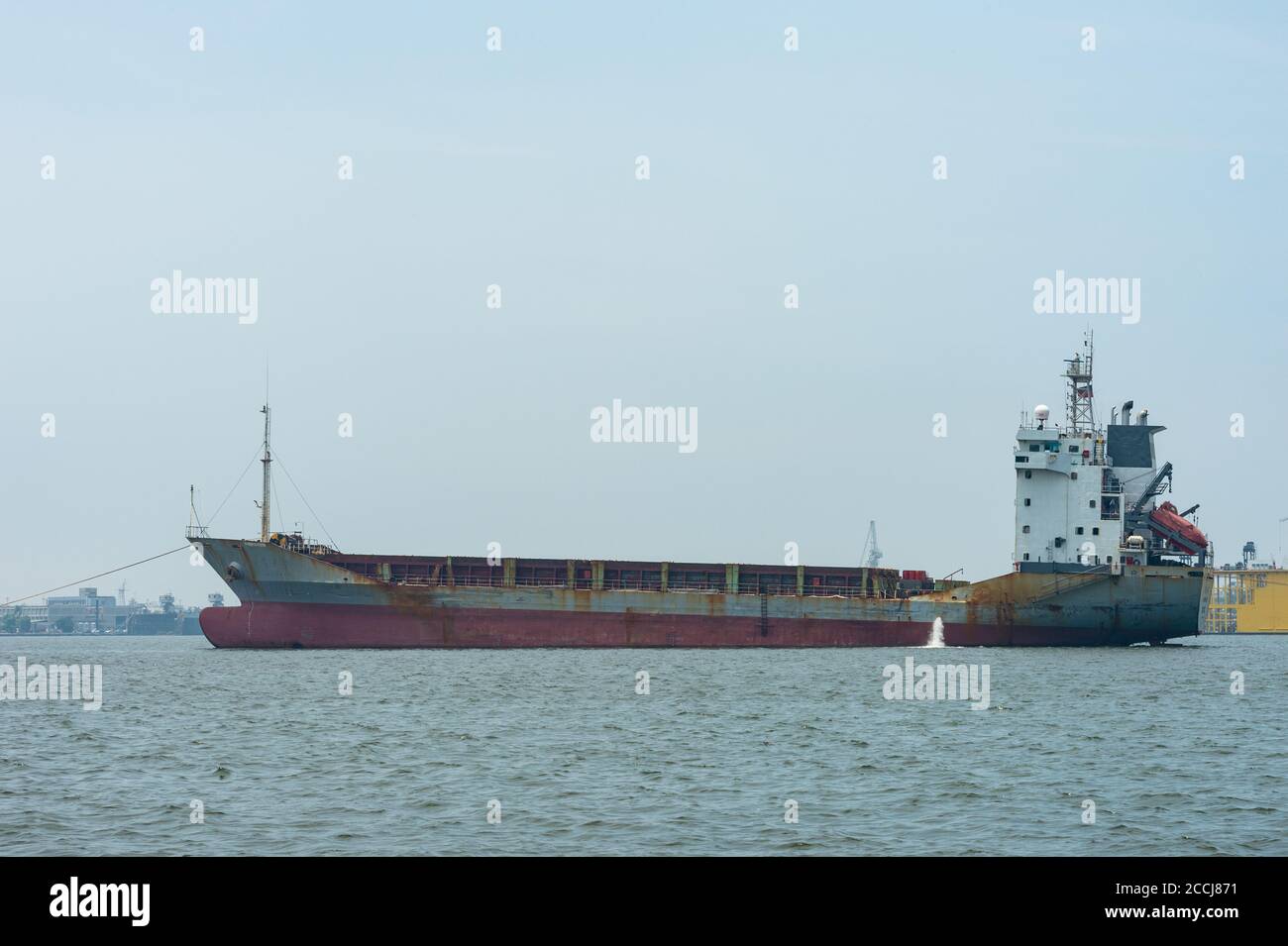 KAOHSIUNG, TAIWAN - CIRCA June, 2018:A large cargo ship moves towards ...