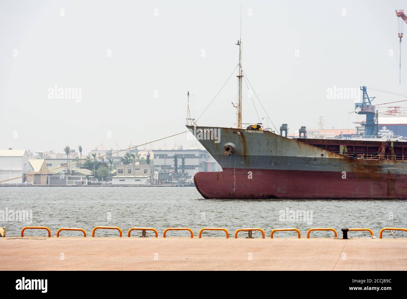 KAOHSIUNG, TAIWAN - CIRCA June, 2018:A large cargo ship moves towards ...
