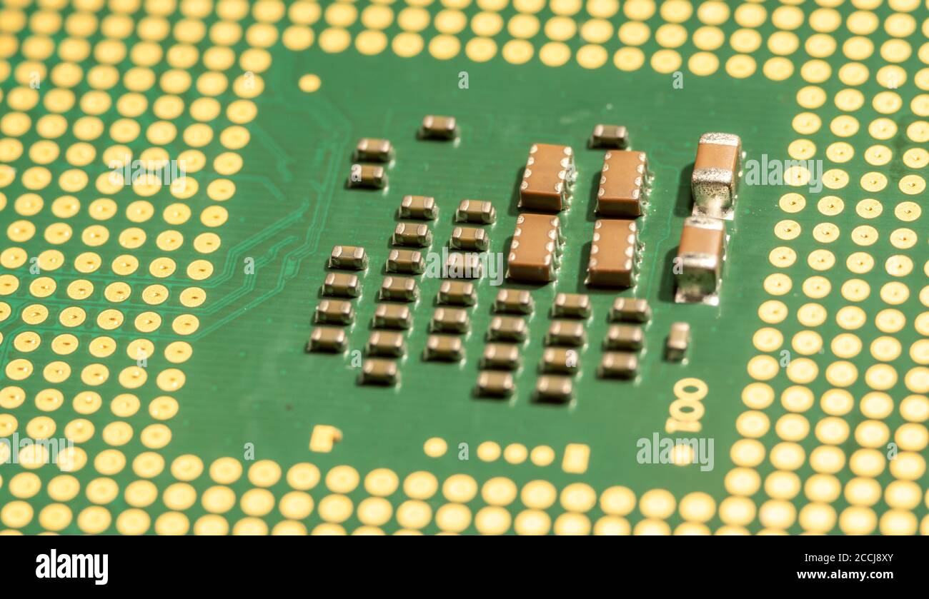 Electronic Board with chips and semiconductor elements close up. The ...