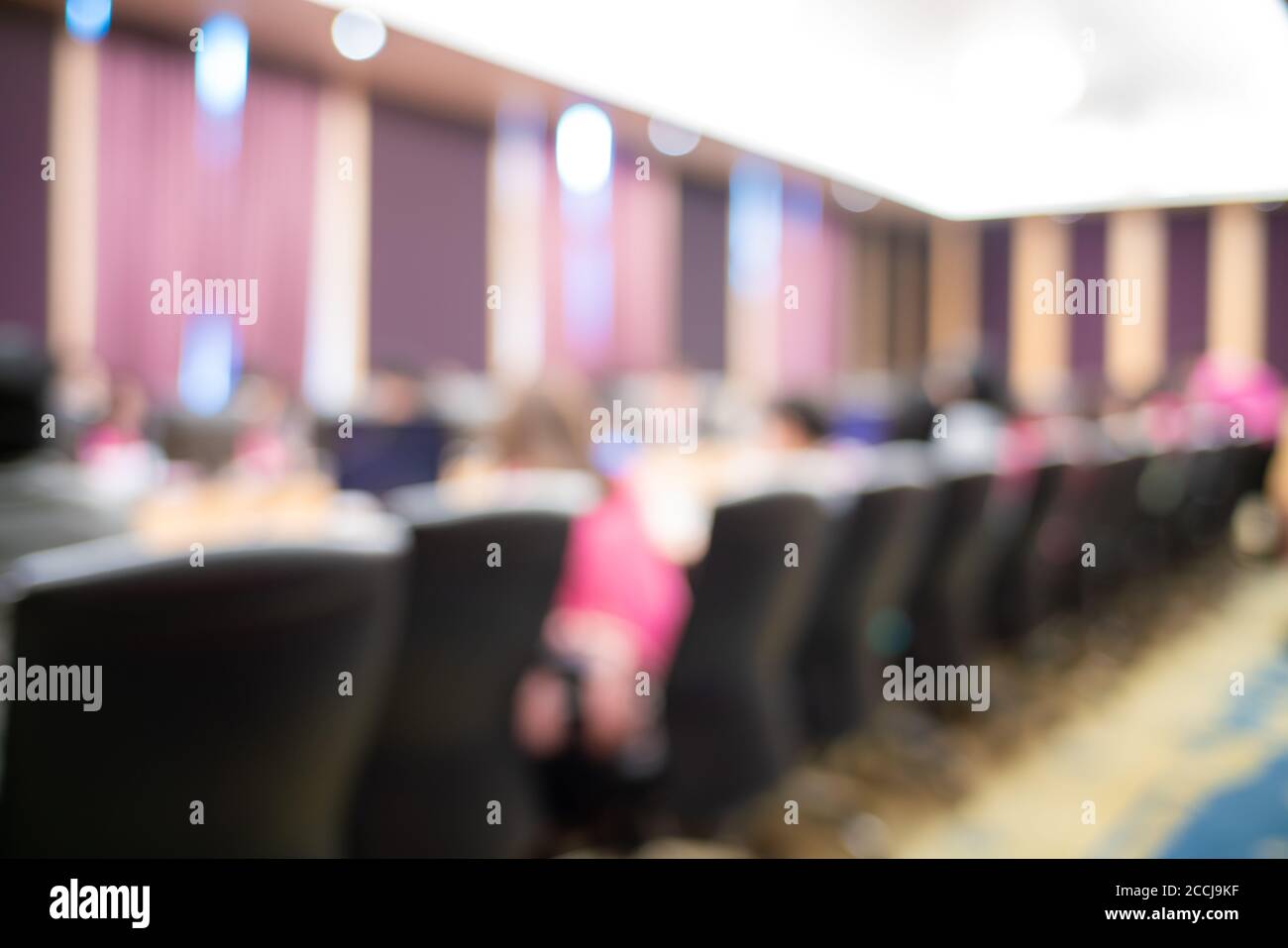 Blurred people sitting in seminar hall room business education Stock ...