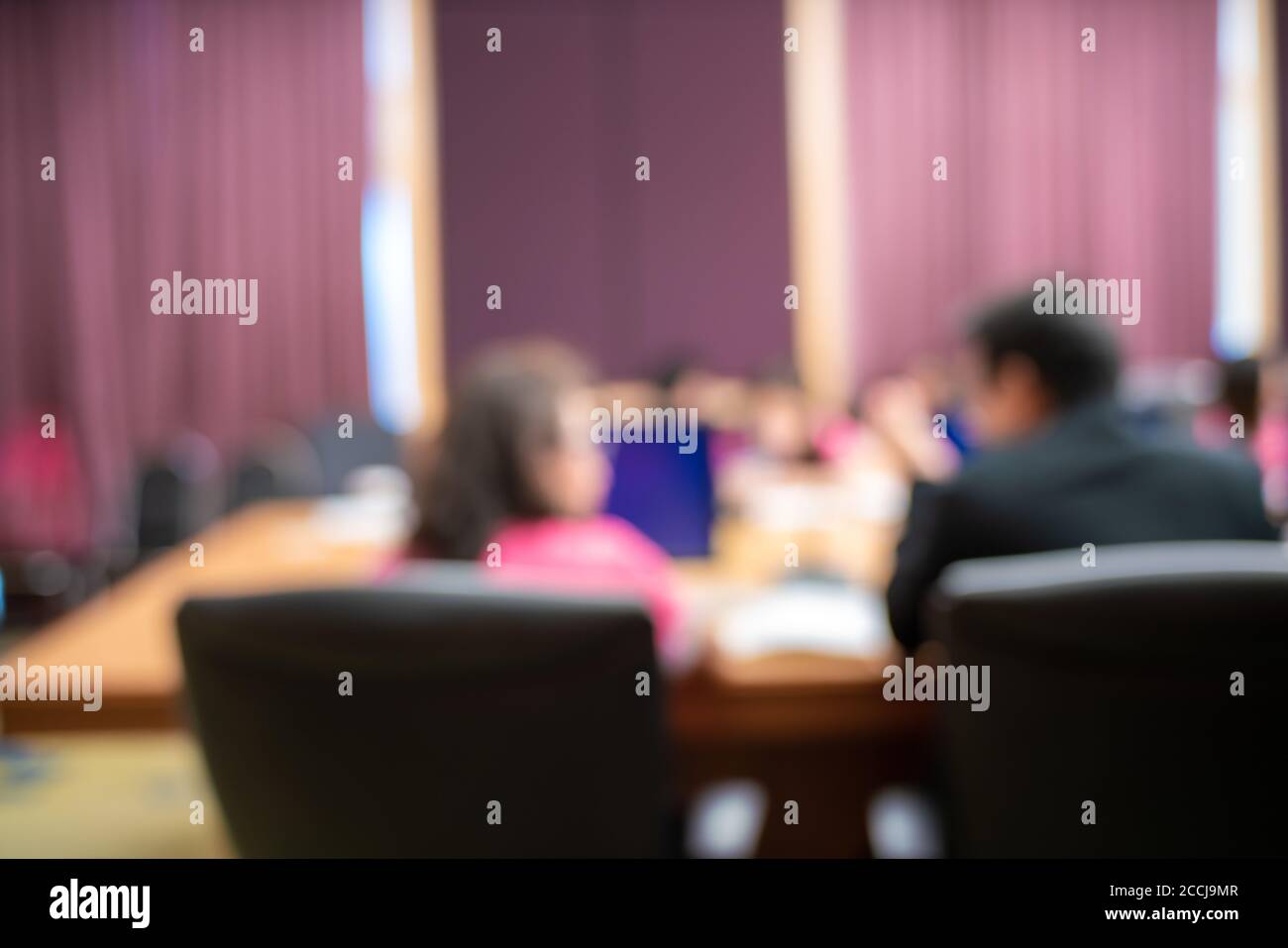 Blurred people sitting in seminar hall room business education Stock ...