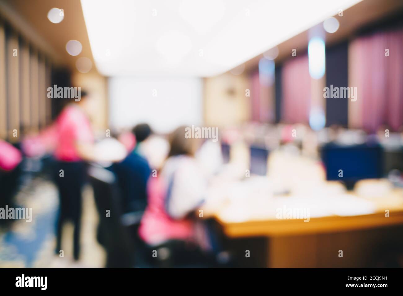 Blurred people sitting in seminar hall room business education Stock ...