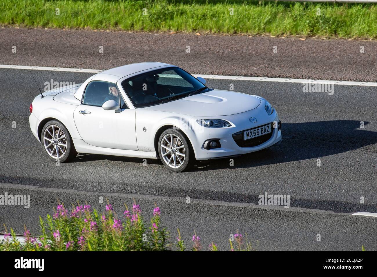 White Mazda Mx-5 I Roadster SPT Tech sportscar; Vehicular traffic ...
