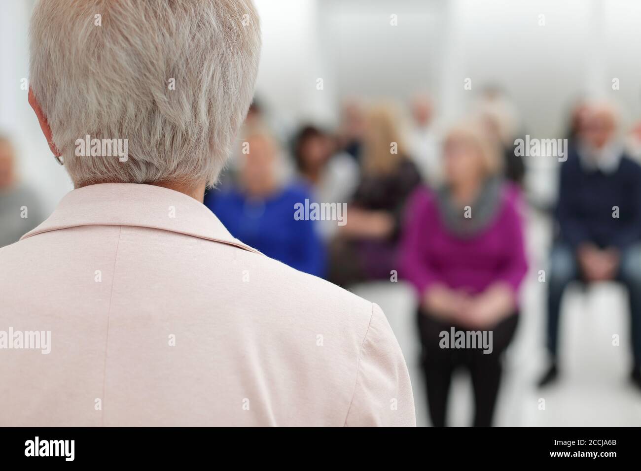 professor stands with his back Stock Photo - Alamy