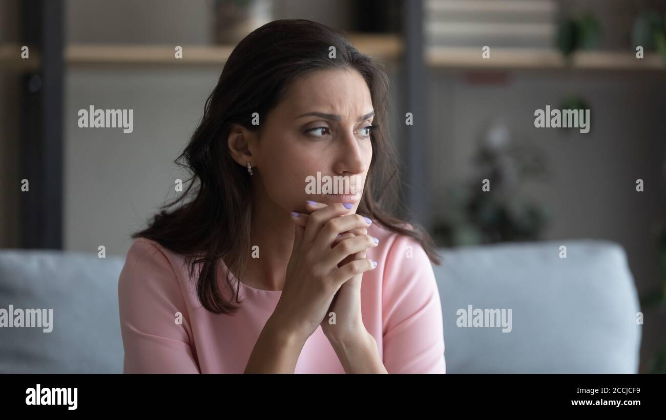 Anxious Arabic woman feel unhappy thinking at home Stock Photo - Alamy