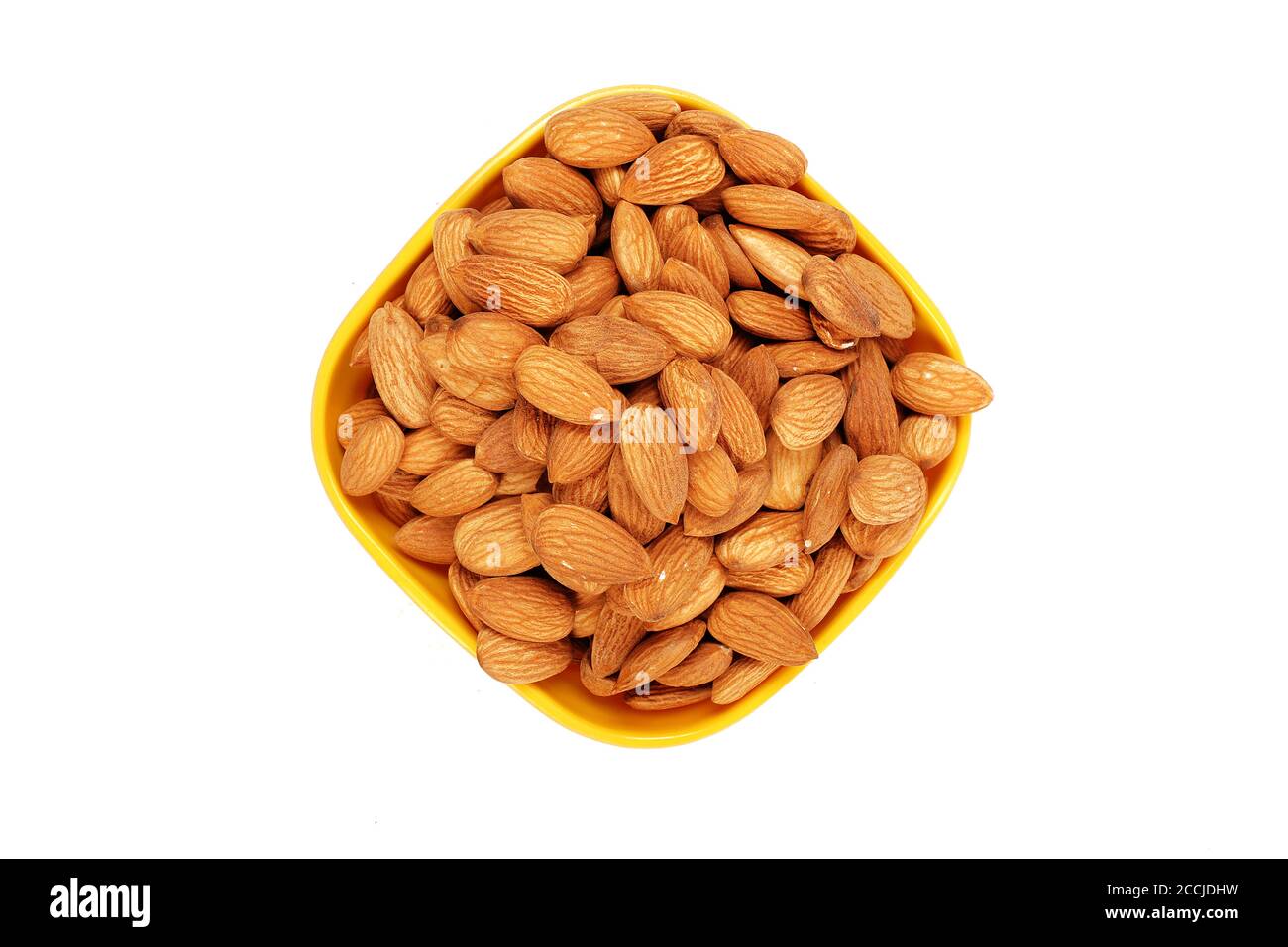 Group of almonds inside and outside bowl isolated on white Stock Photo ...