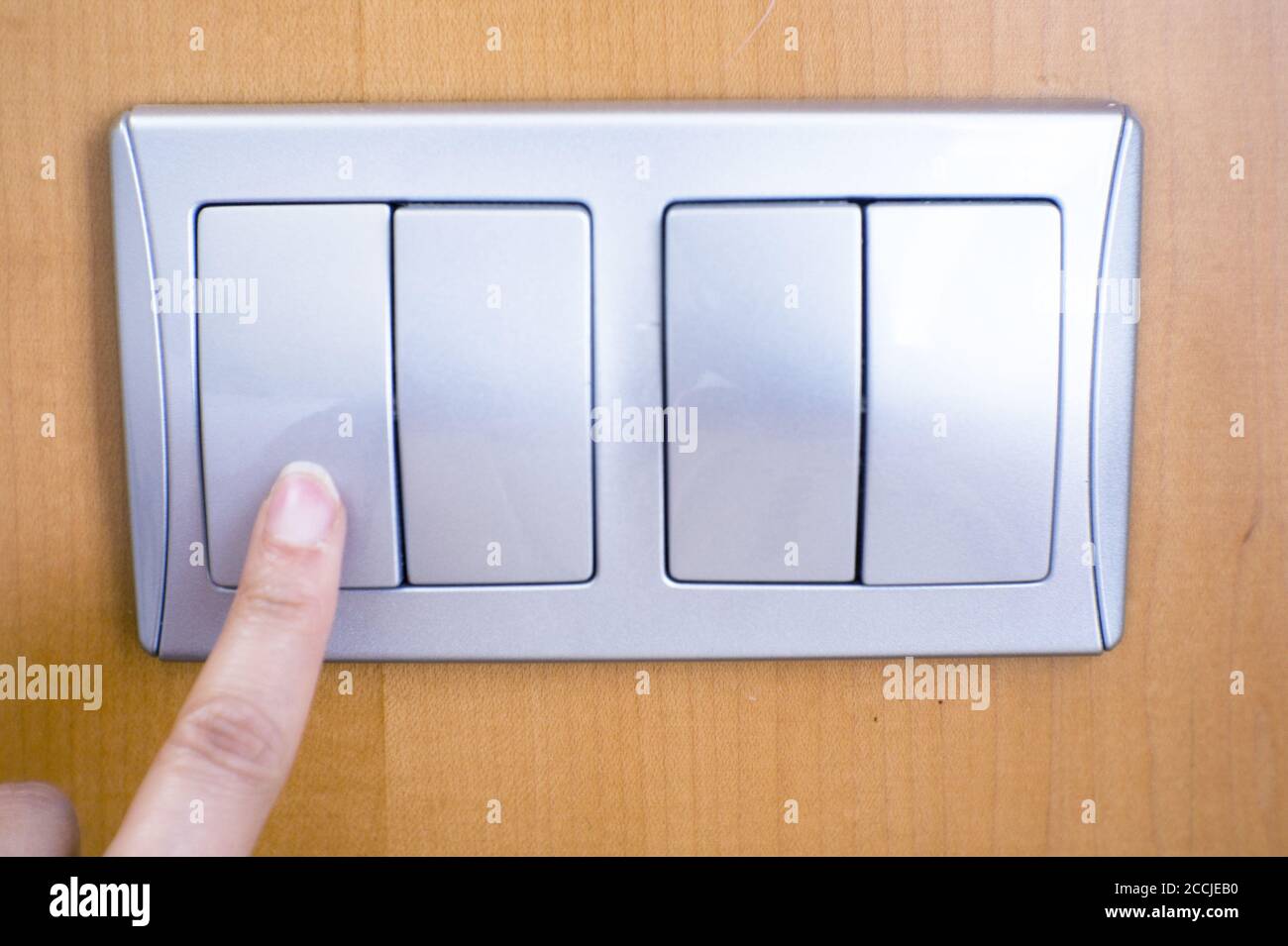 Womans hand light switch hi-res stock photography and images - Alamy