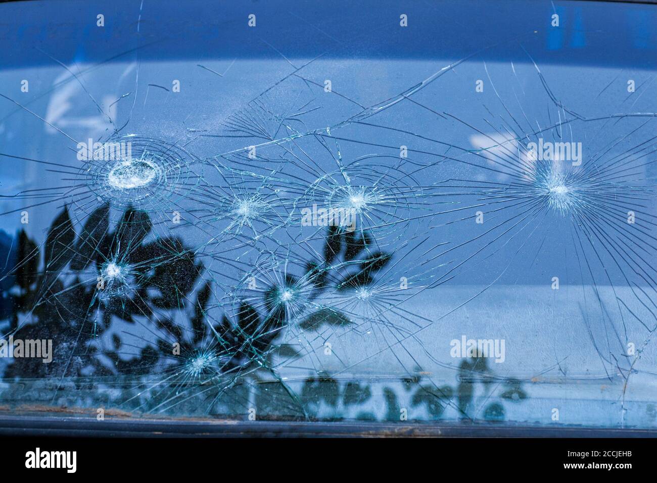 Car hit with a bullet hi-res stock photography and images - Alamy