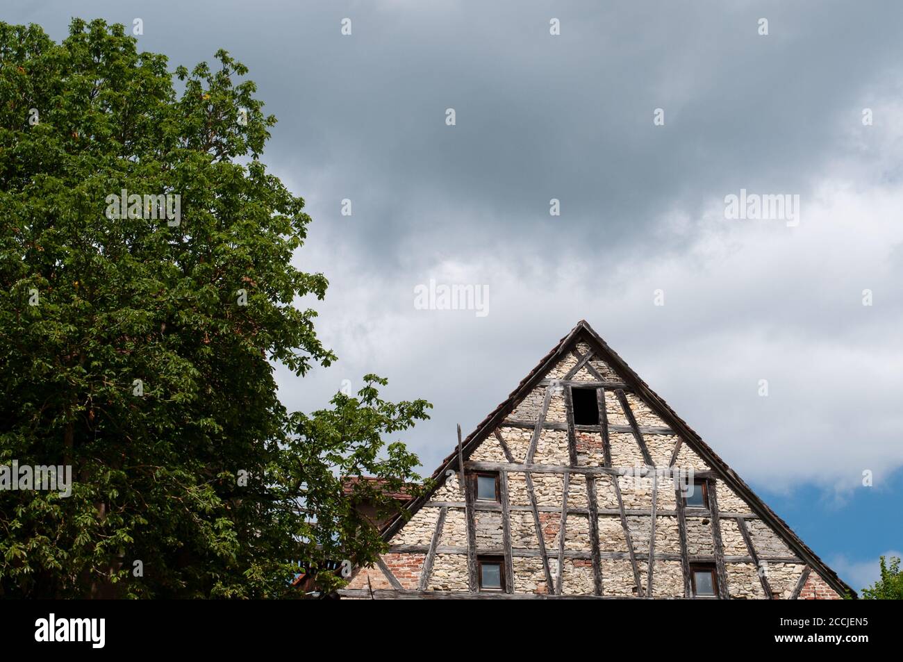 a half-timbered gable at an old house in a german village filled with ...