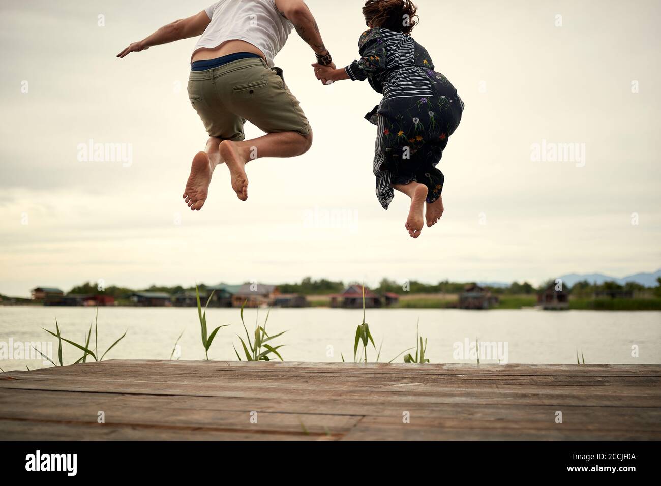 Couple jumping lake hi-res stock photography and images - Alamy