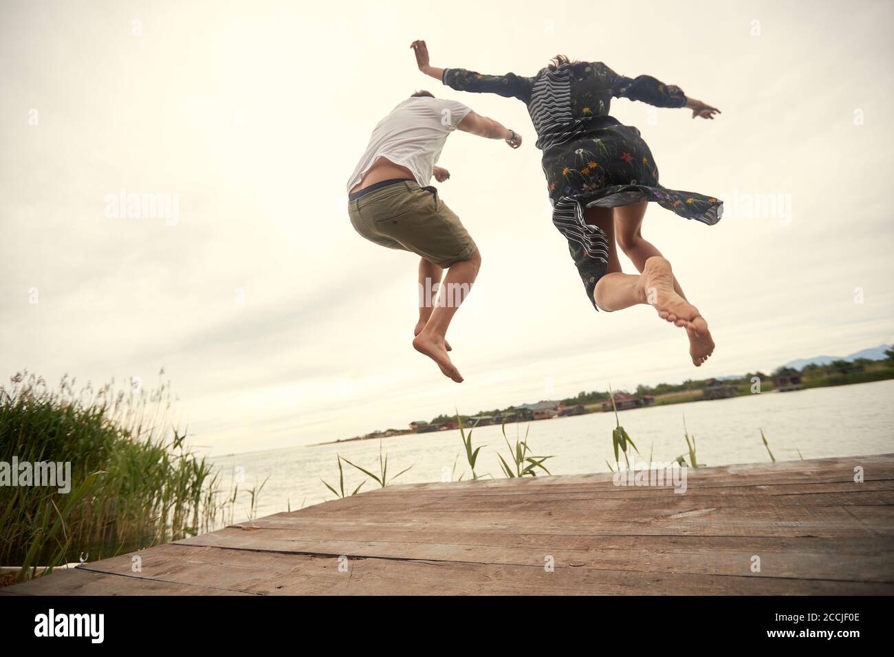 Couple jumping lake hi-res stock photography and images - Alamy