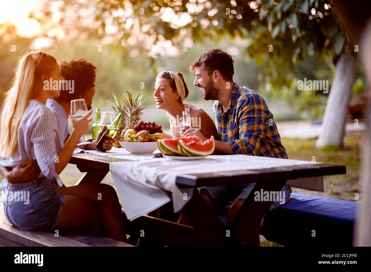 Young friends having fun outdoor, talking and laughing enjoying at ...