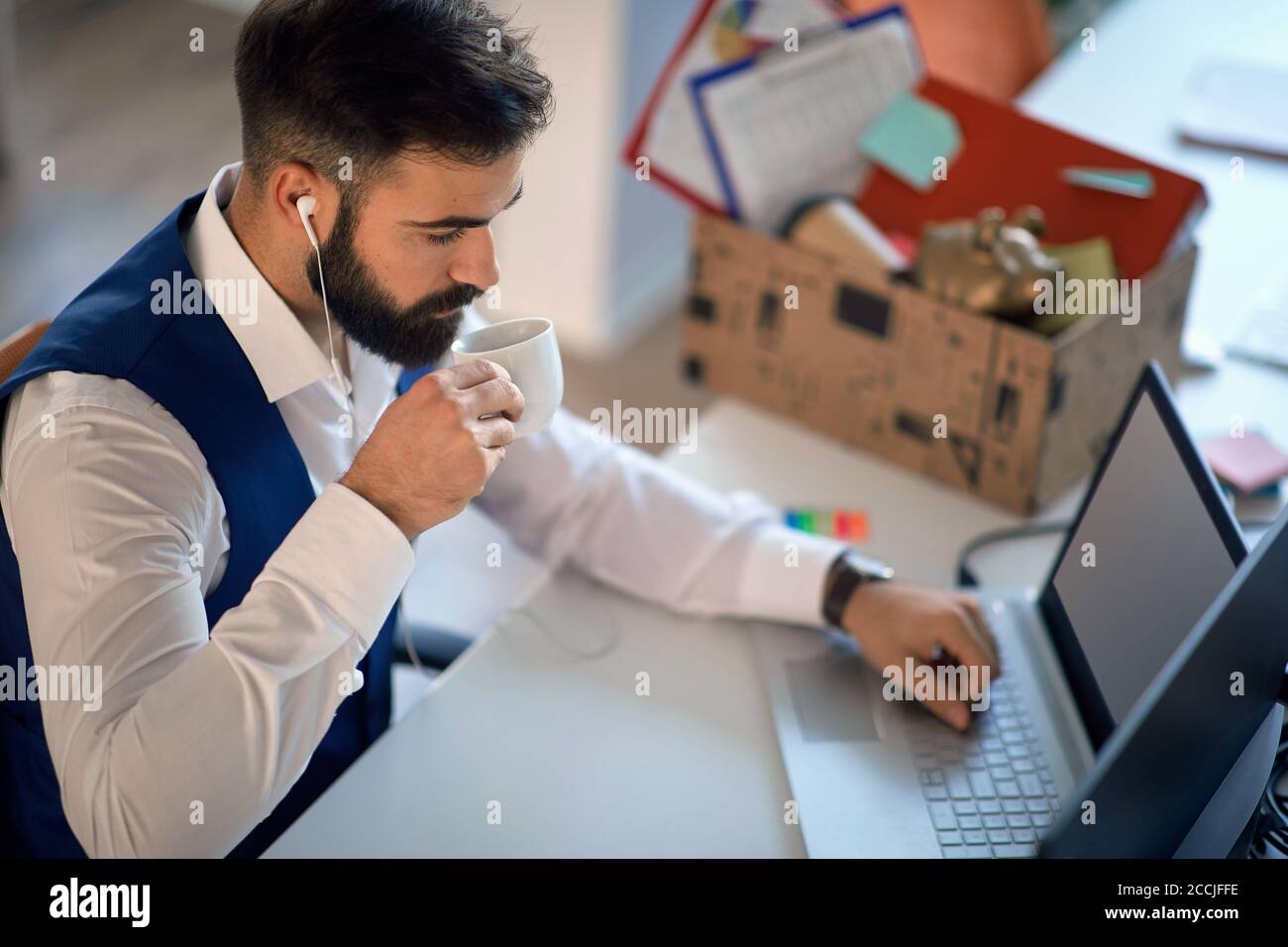 Young business man working on computer in the office Stock Photo - Alamy