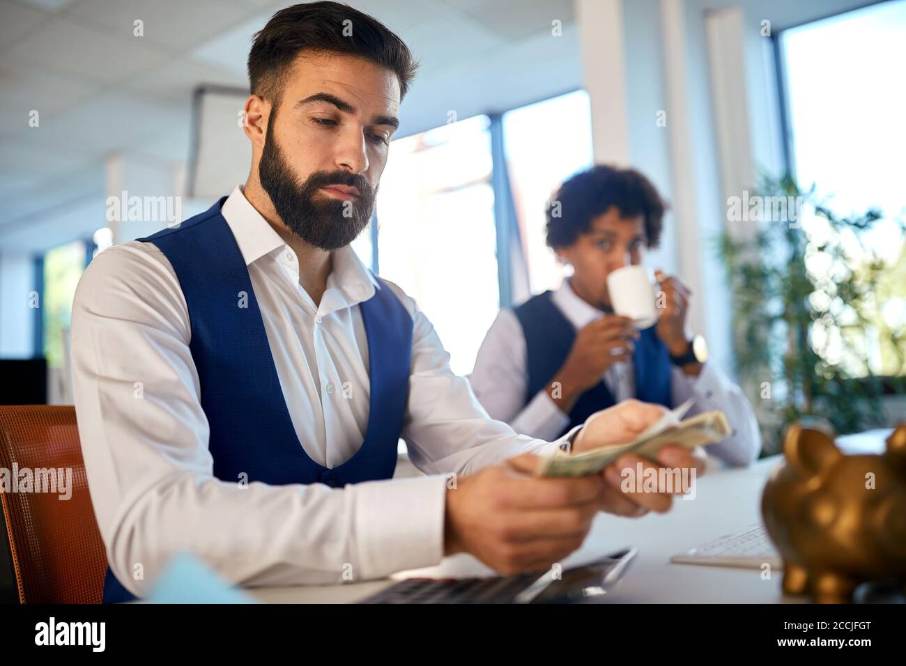 Accountant counting and checking money in the office Stock Photo - Alamy
