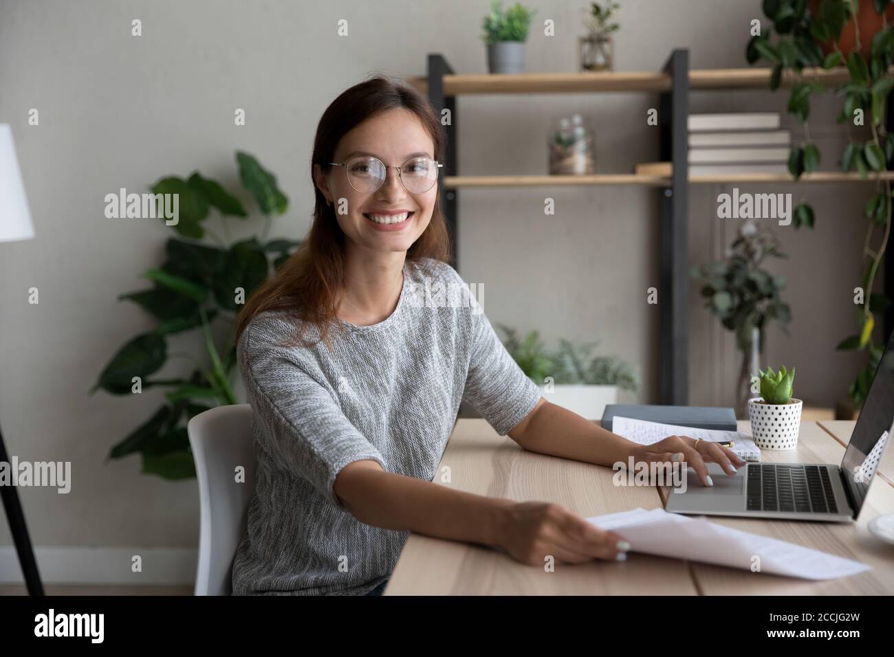 Girl laptop papers happy hi-res stock photography and images - Alamy