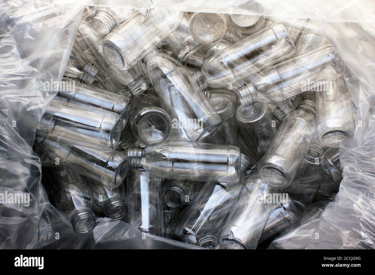 Clean plastic bottles stacked in a factory Stock Photo - Alamy