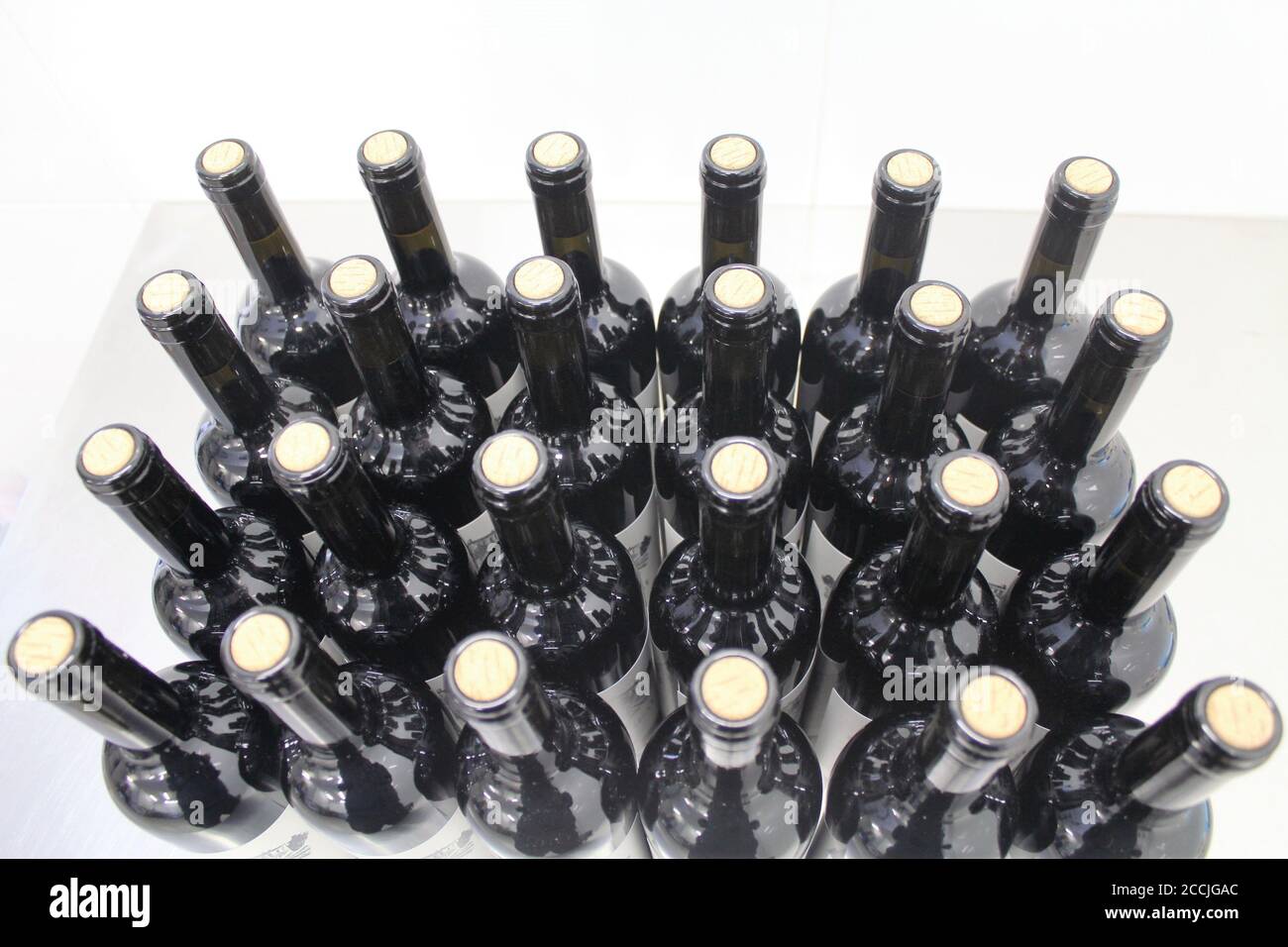 Glass bottles stacked in a wine factory Stock Photo - Alamy
