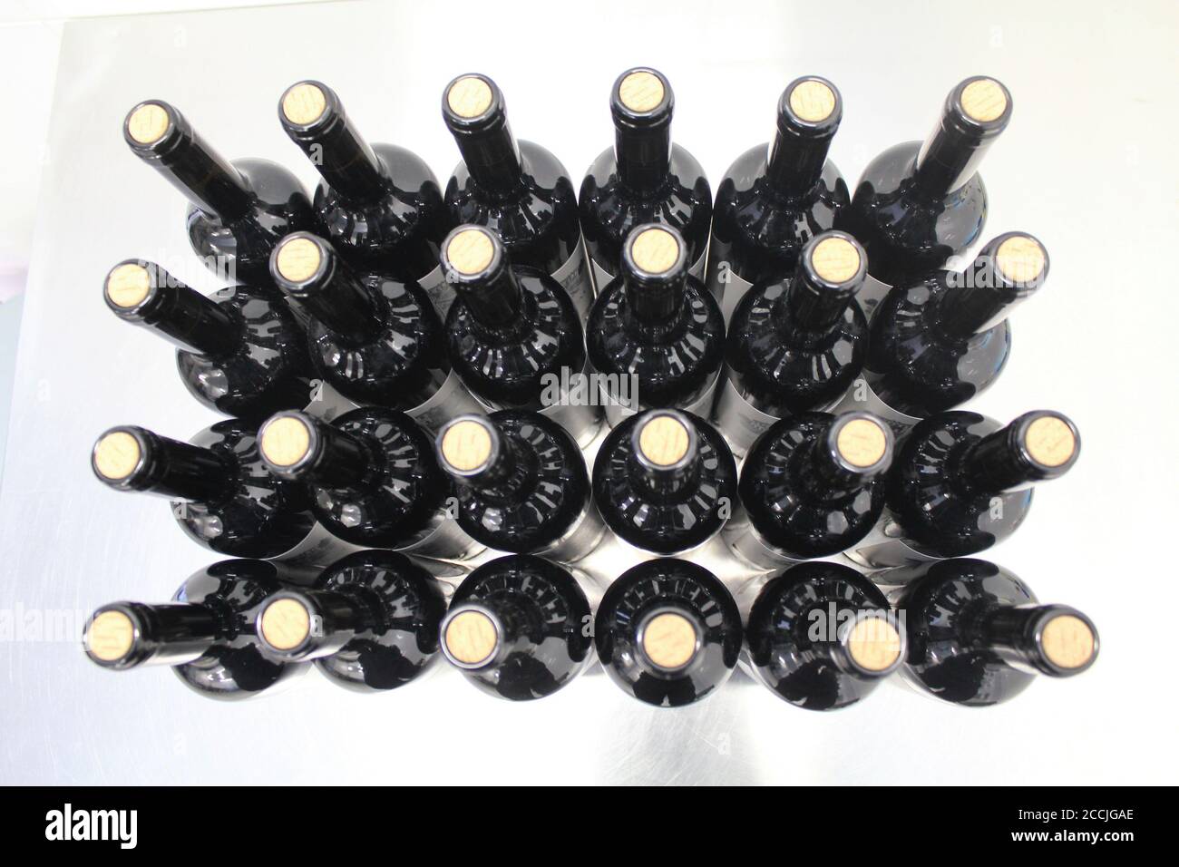 Glass bottles stacked in a wine factory Stock Photo - Alamy