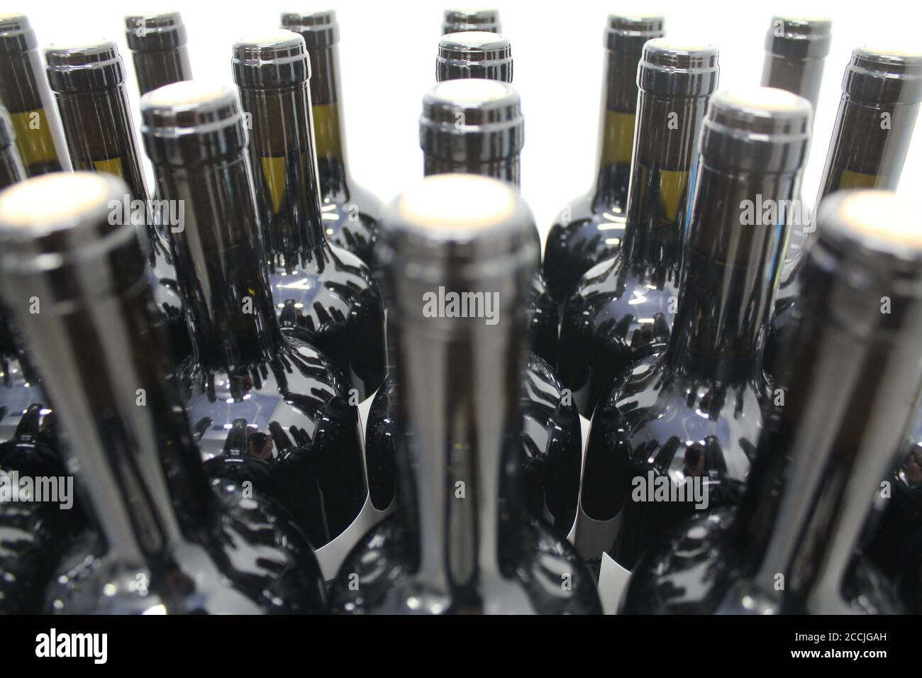 Glass bottles stacked in a wine factory Stock Photo - Alamy