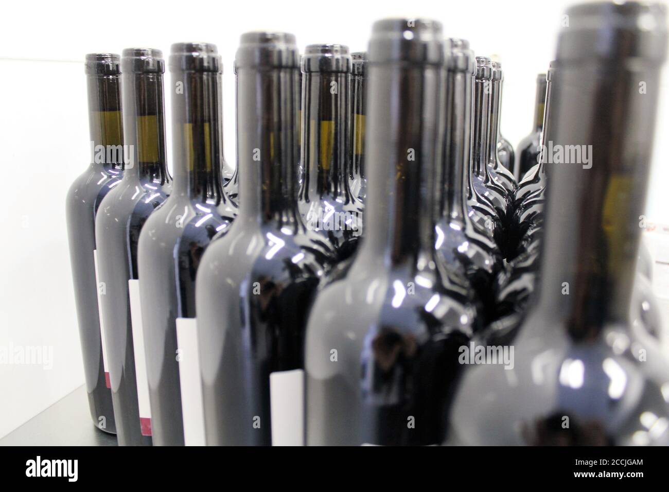 Glass bottles stacked in a wine factory Stock Photo - Alamy