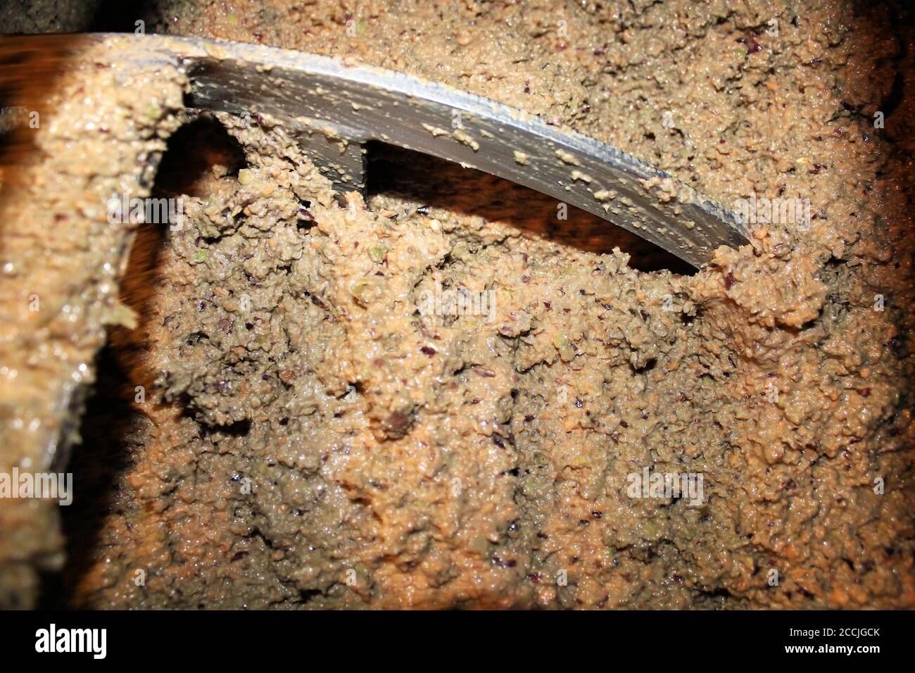 Greece, Attica, olive paste in malaxation tank during extra virgin ...