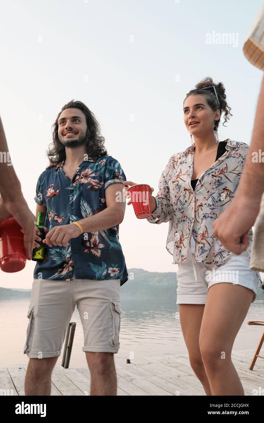 Group of young people drinking alcohol and dancing on open air Stock ...