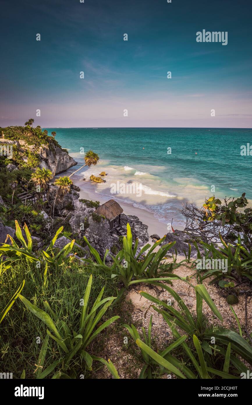Sunset view at Mayan ruins of Tulum at the tropical coast. El Castillo ...
