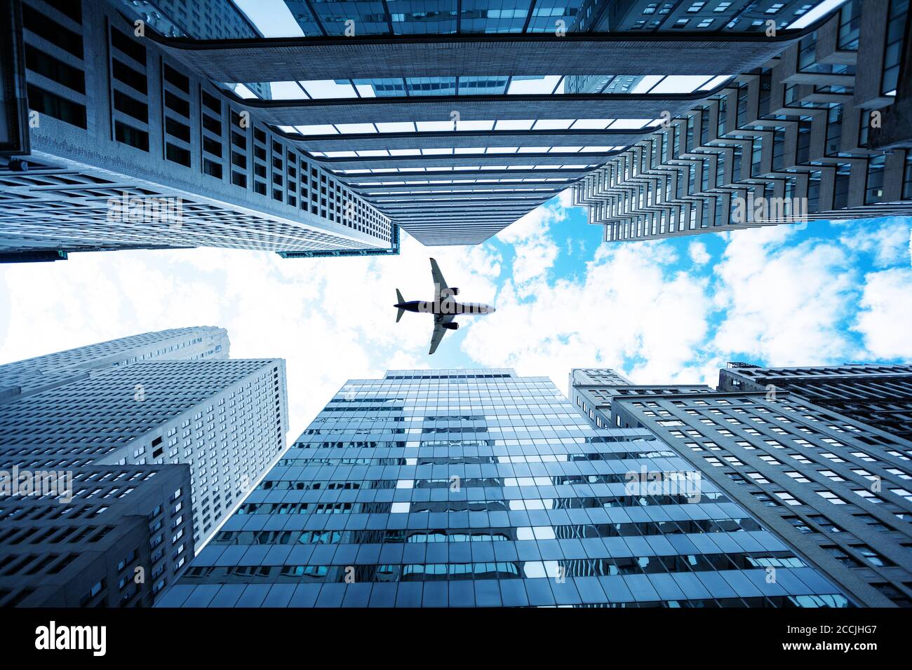 Plane over buildings new york hi-res stock photography and images - Alamy