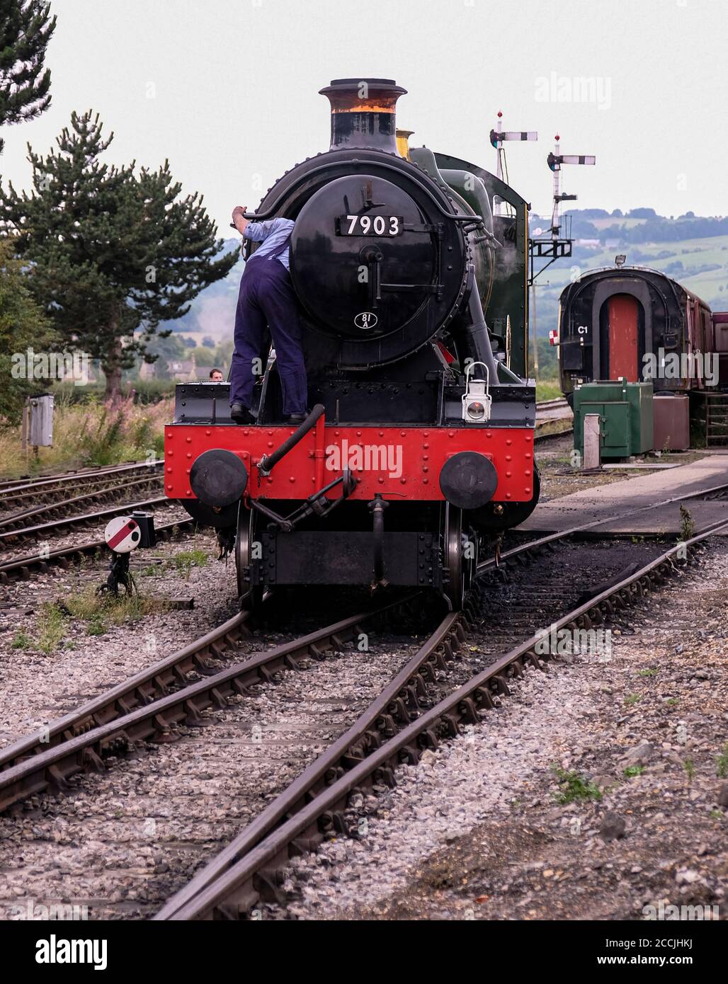 An engineer inspects inside a steam train boiler on Gloucestershire ...