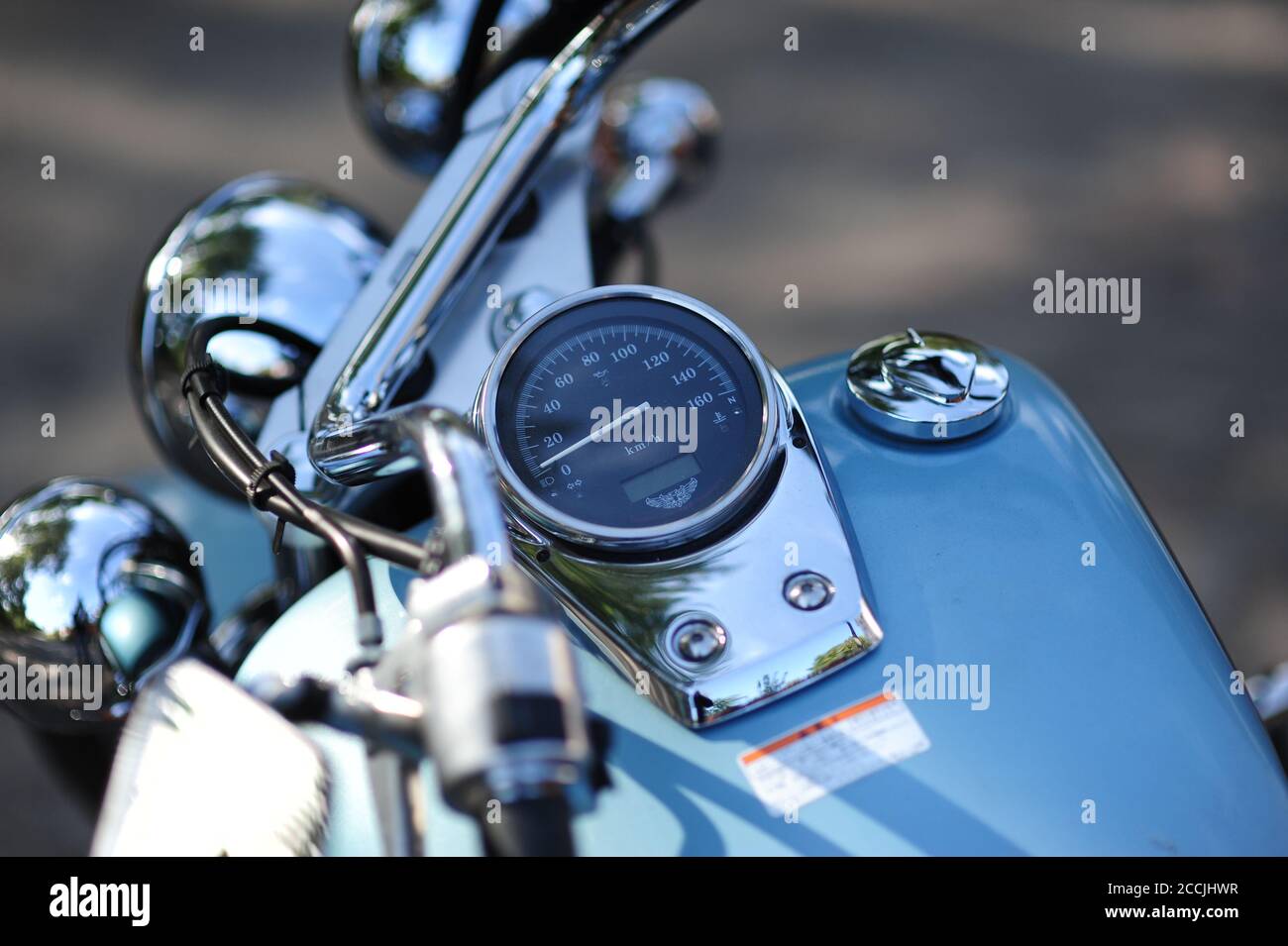 Motorcycle detail with gasoline tank and speedometer. Chrome motorcycle ...