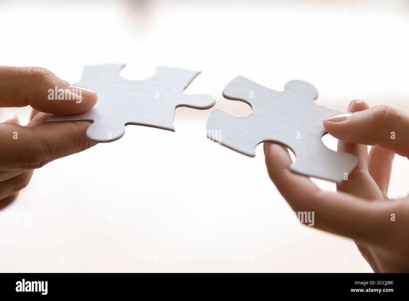 Business people connecting puzzle pieces hi-res stock photography and ...