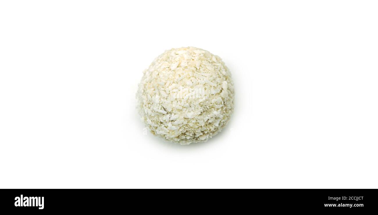 Delicious, round coconut candy with a nut inside on a white background ...