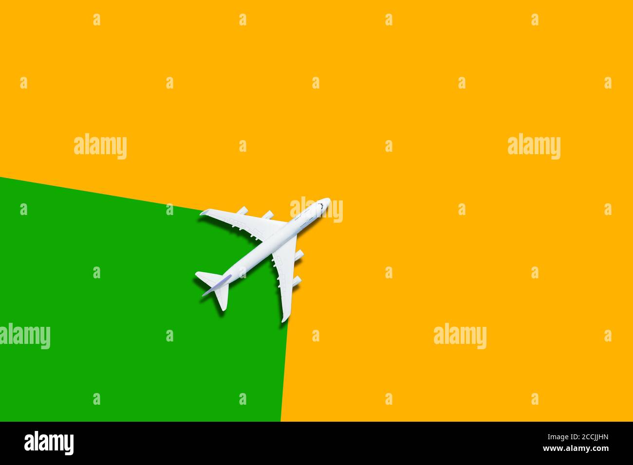 White plane, airplane on color background with copy space. Top view ...