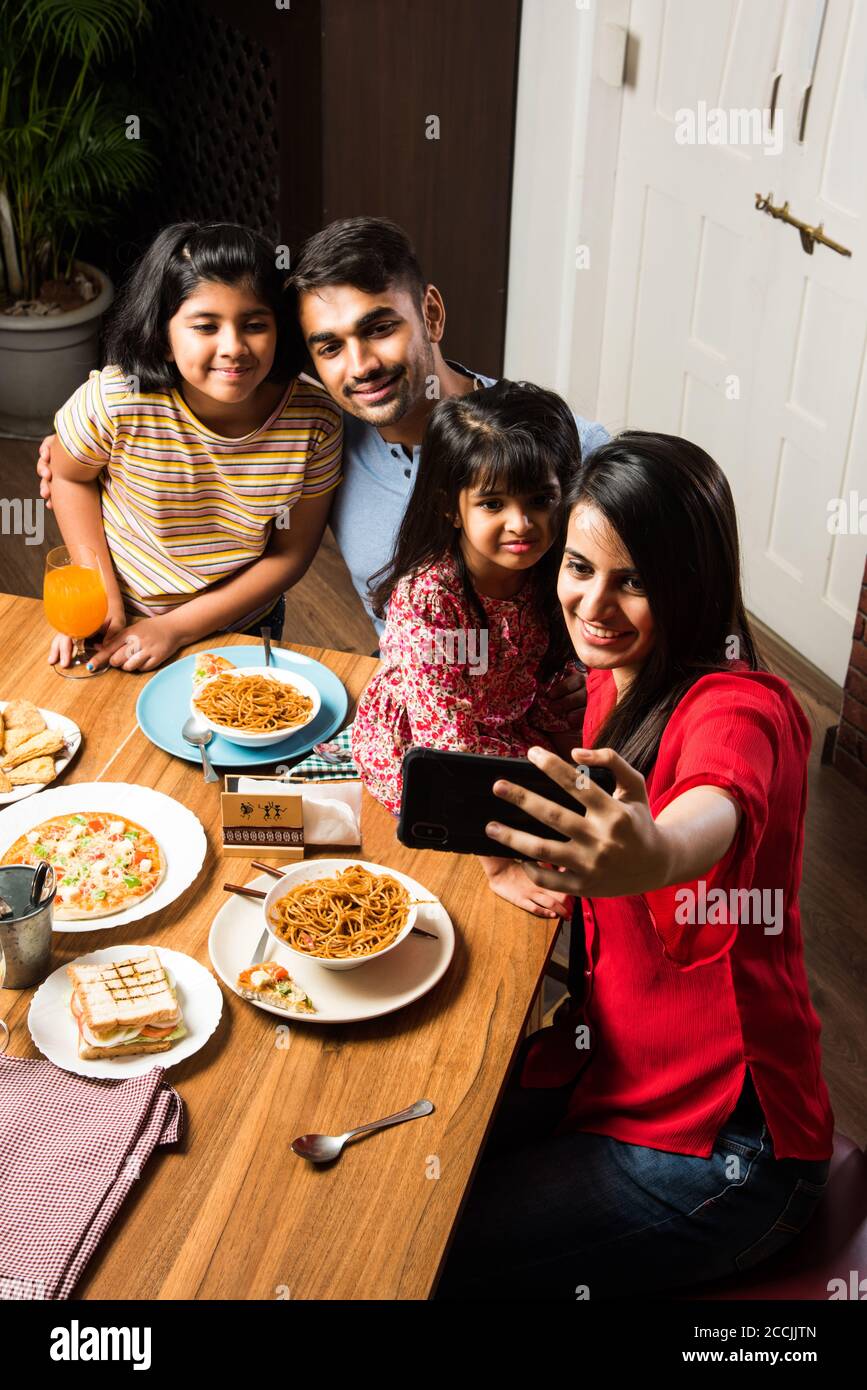 Dining Table With Food And Indian Family Image Of Indian