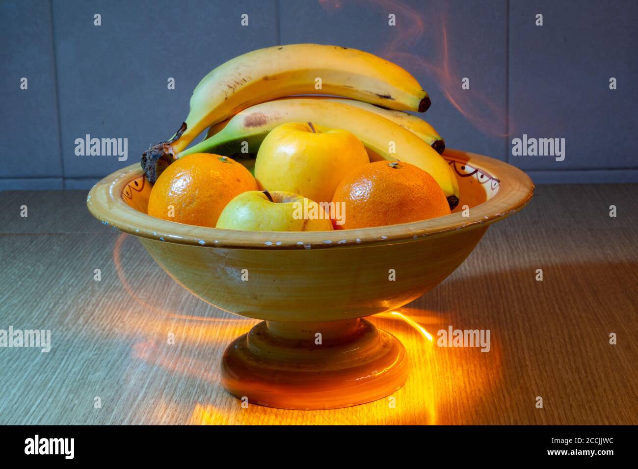Still life with fruit such as banana, orange and apple. Using long ...