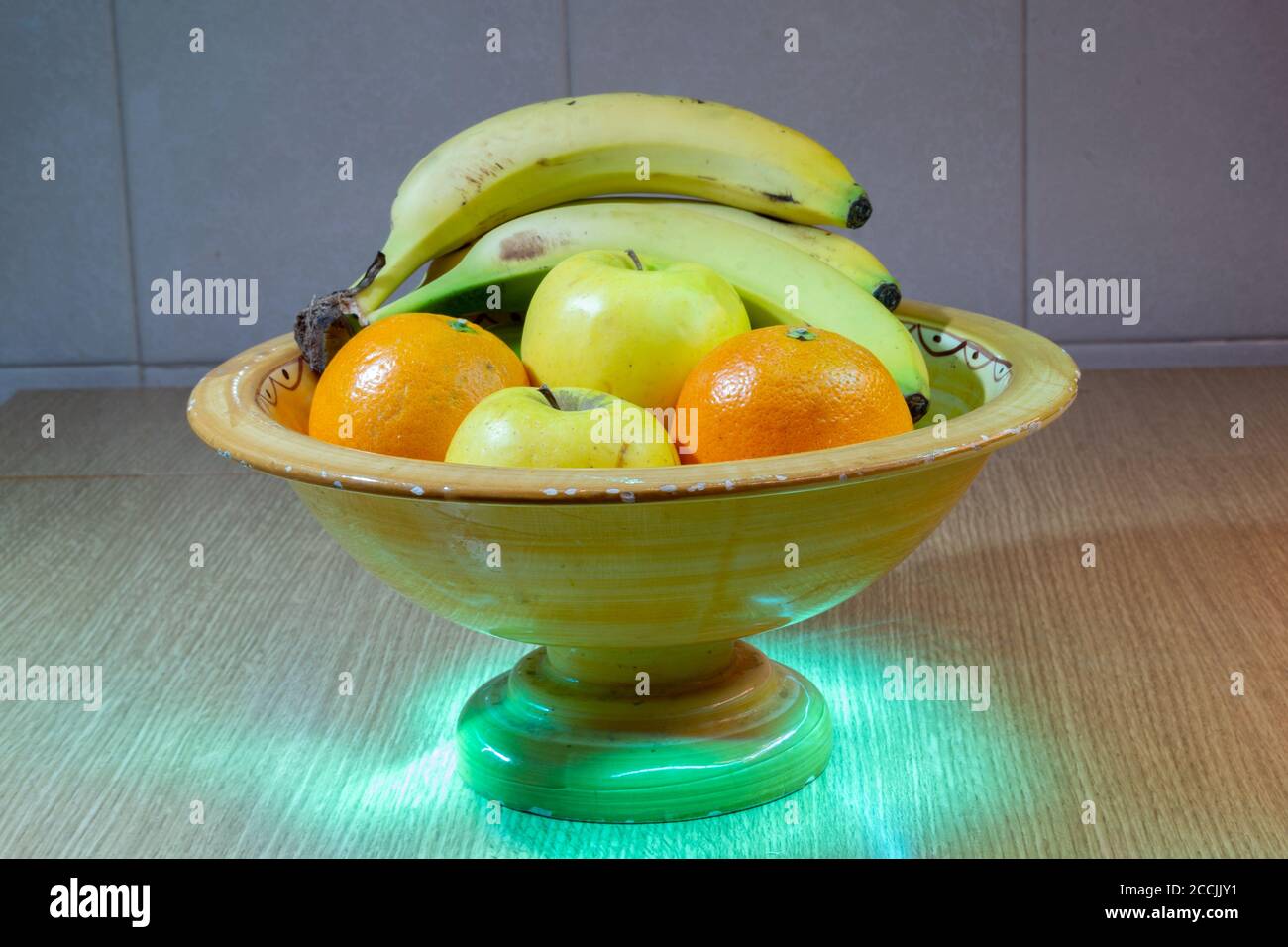 Still life with fruit such as banana, orange and apple. Using long ...