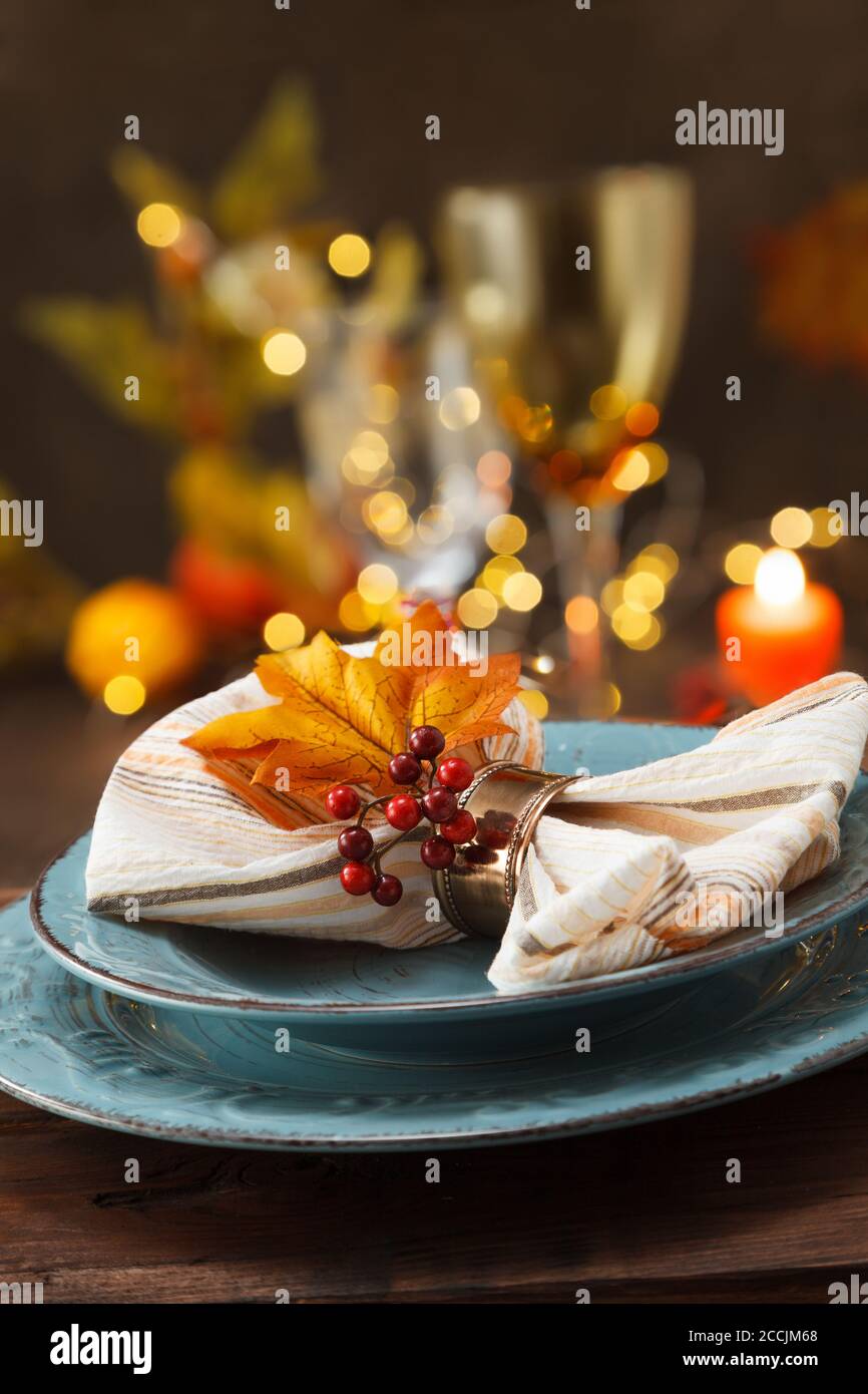 Thanksgiving autumn place setting with cutlery and arrangement of ...