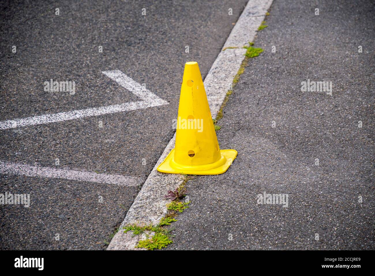 yellow warning cap on the road Stock Photo - Alamy