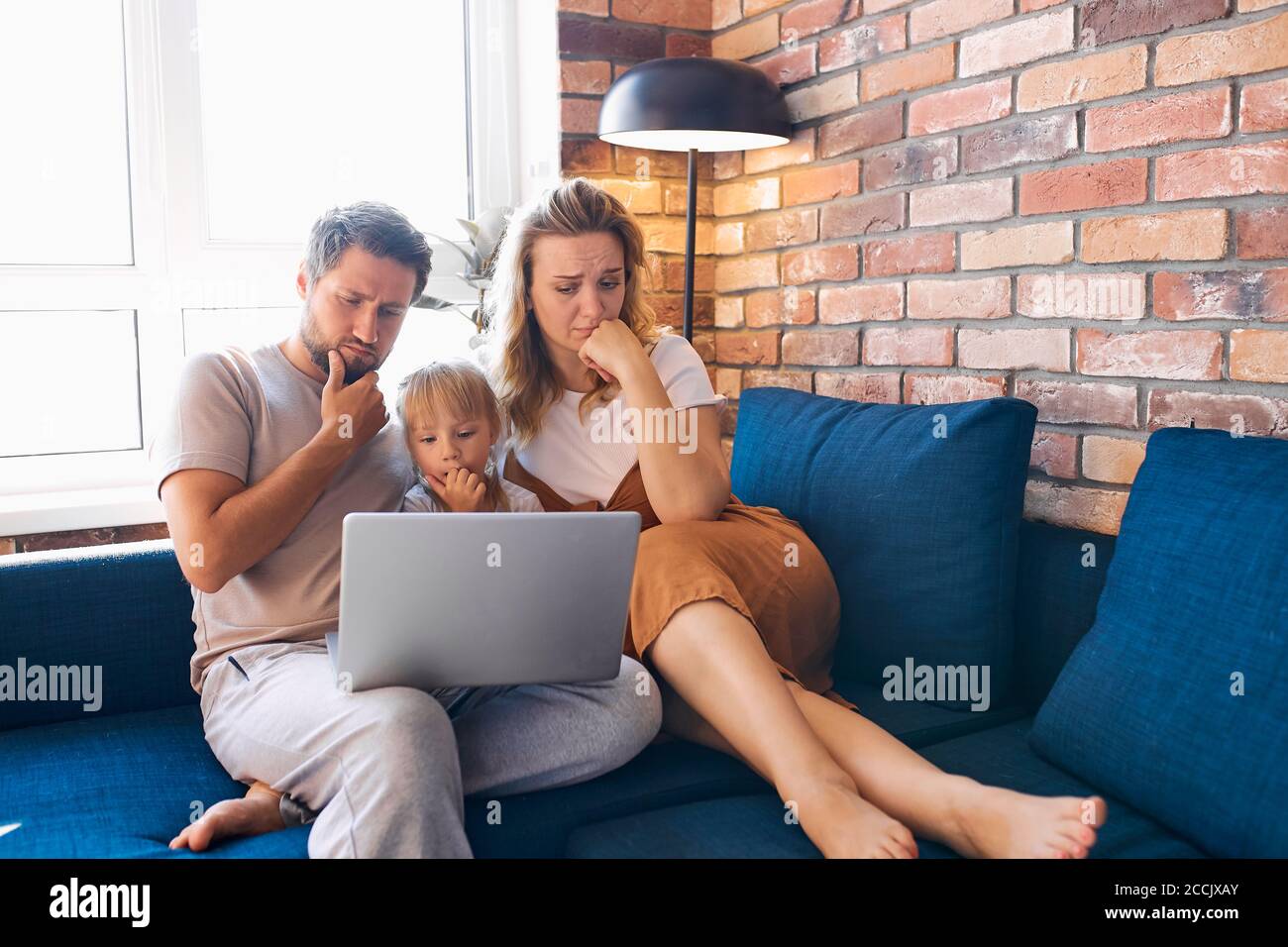 Child with parents on computer screen hi-res stock photography and ...