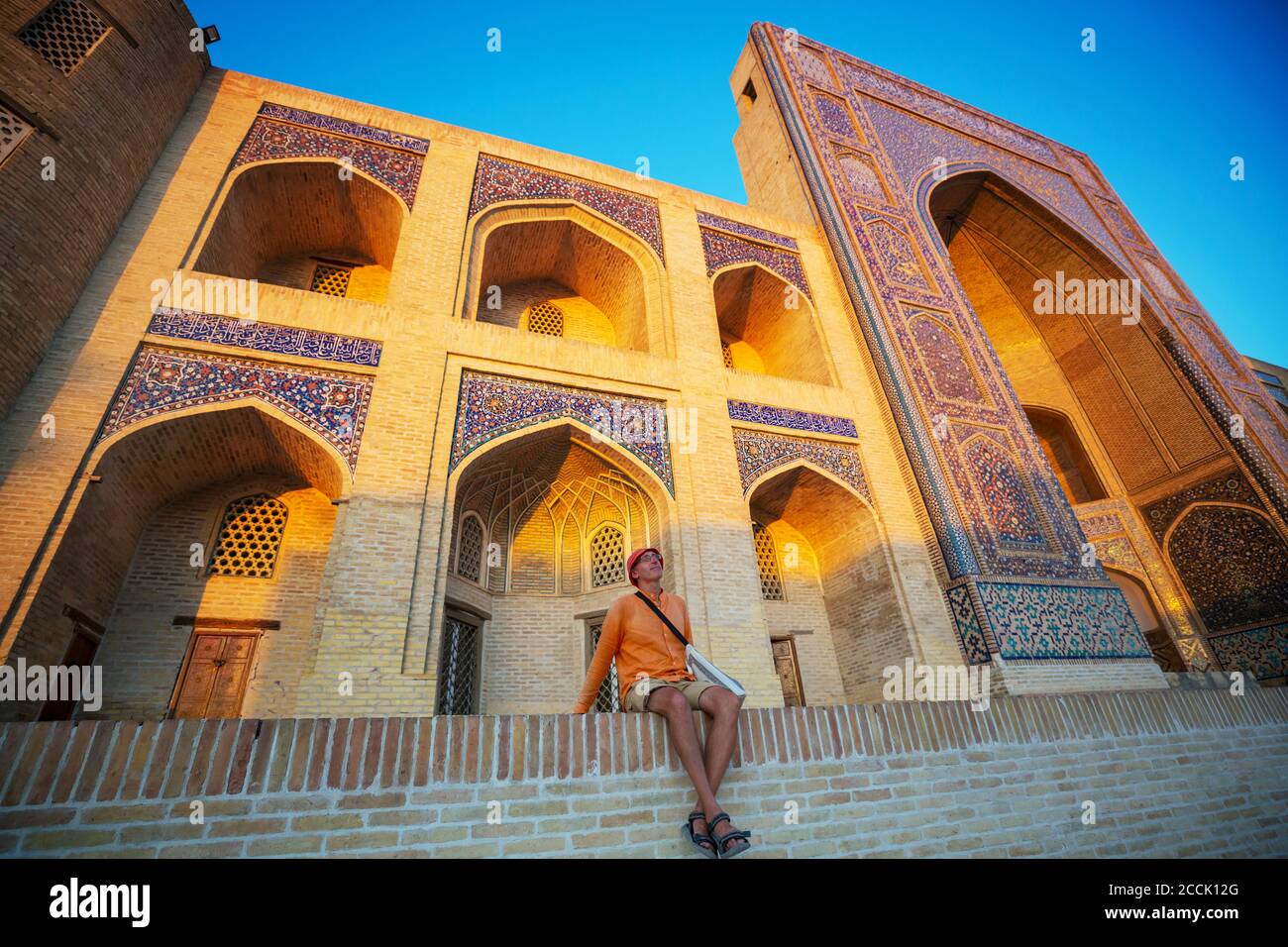 Tourist near ancient historic building in Uzbekistan Stock Photo - Alamy