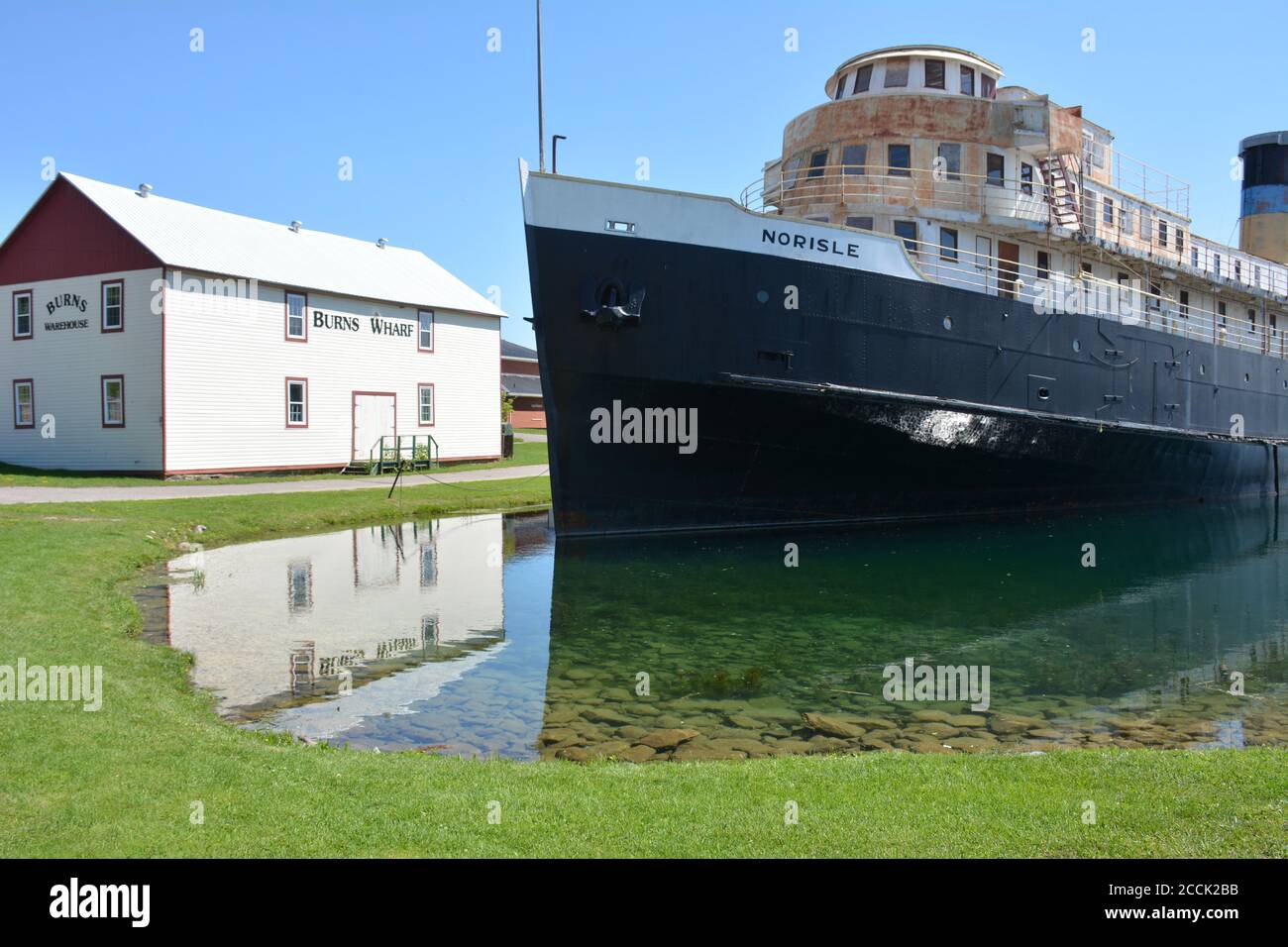 Old Great Lakes freighter at rest in small pier on Manitoulin Island ...