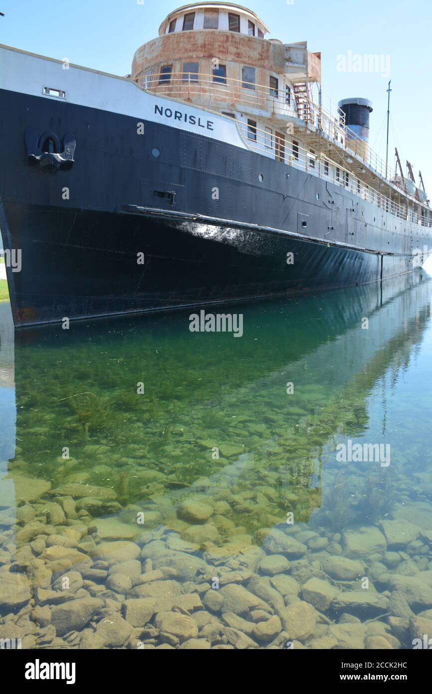 Old Great Lakes freighter at rest in small pier on Manitoulin Island ...