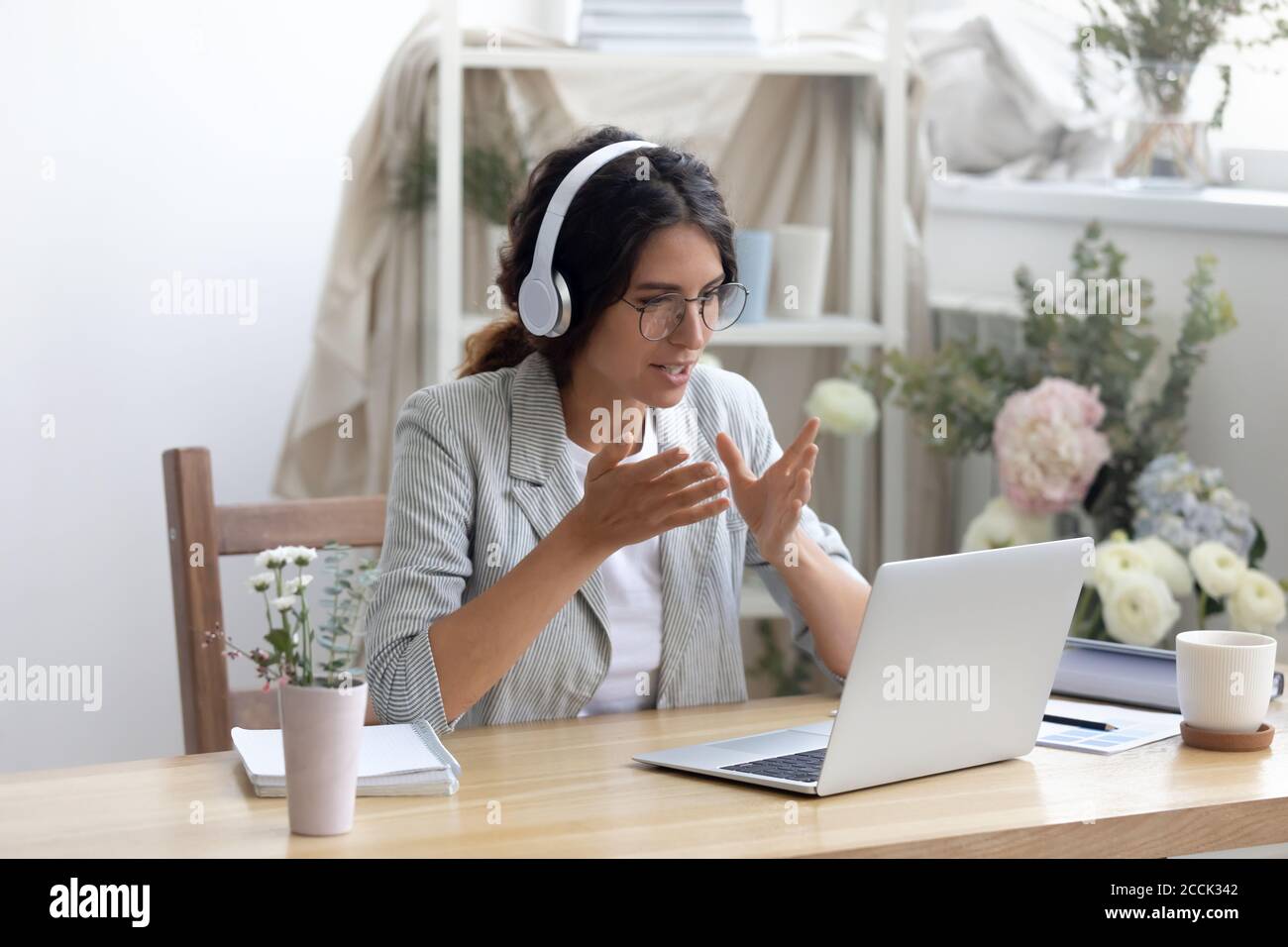 Young creative businesswoman enjoying video call conversation Stock ...